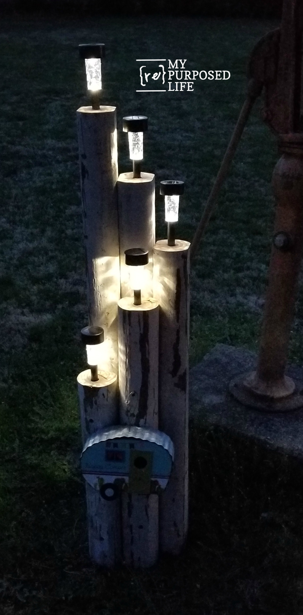 Dollar store Solar Lights on Landscape Timbers - My Repurposed Life®